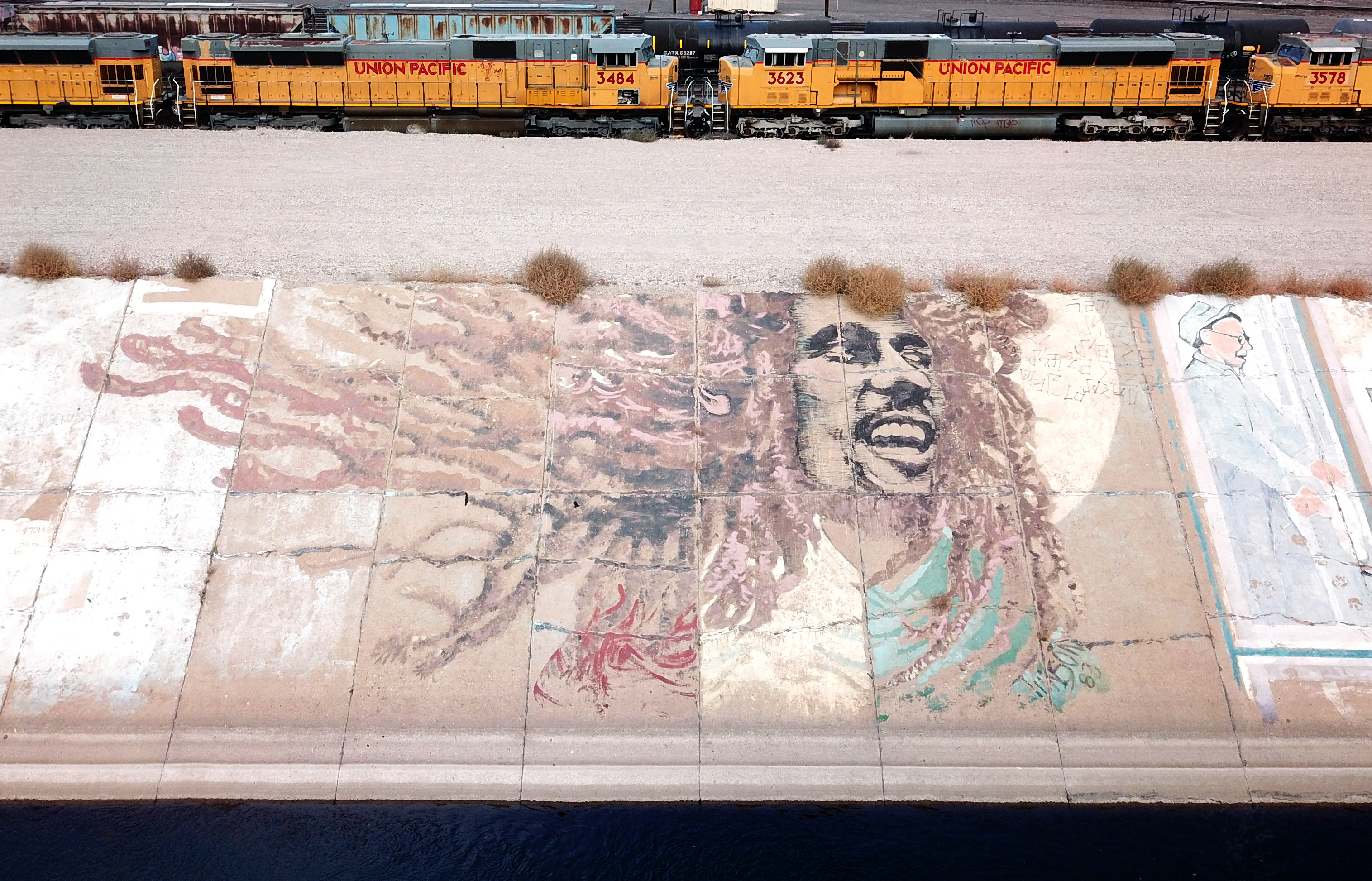 Murals return to Pueblo’s levee as artists make concrete above the ...
